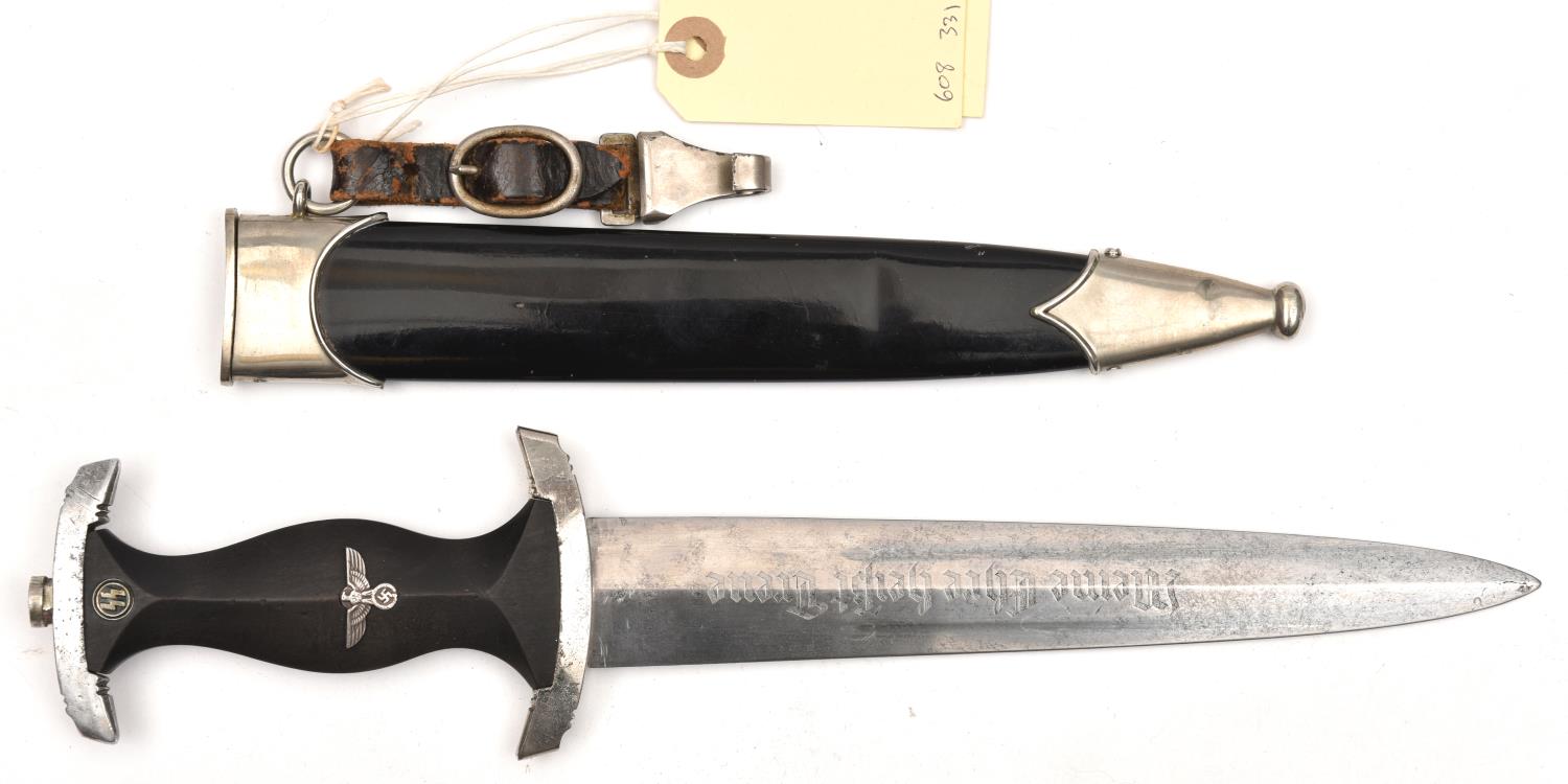 A Third Reich SS dagger, the blade etched with SS runes in circle, "121 ...