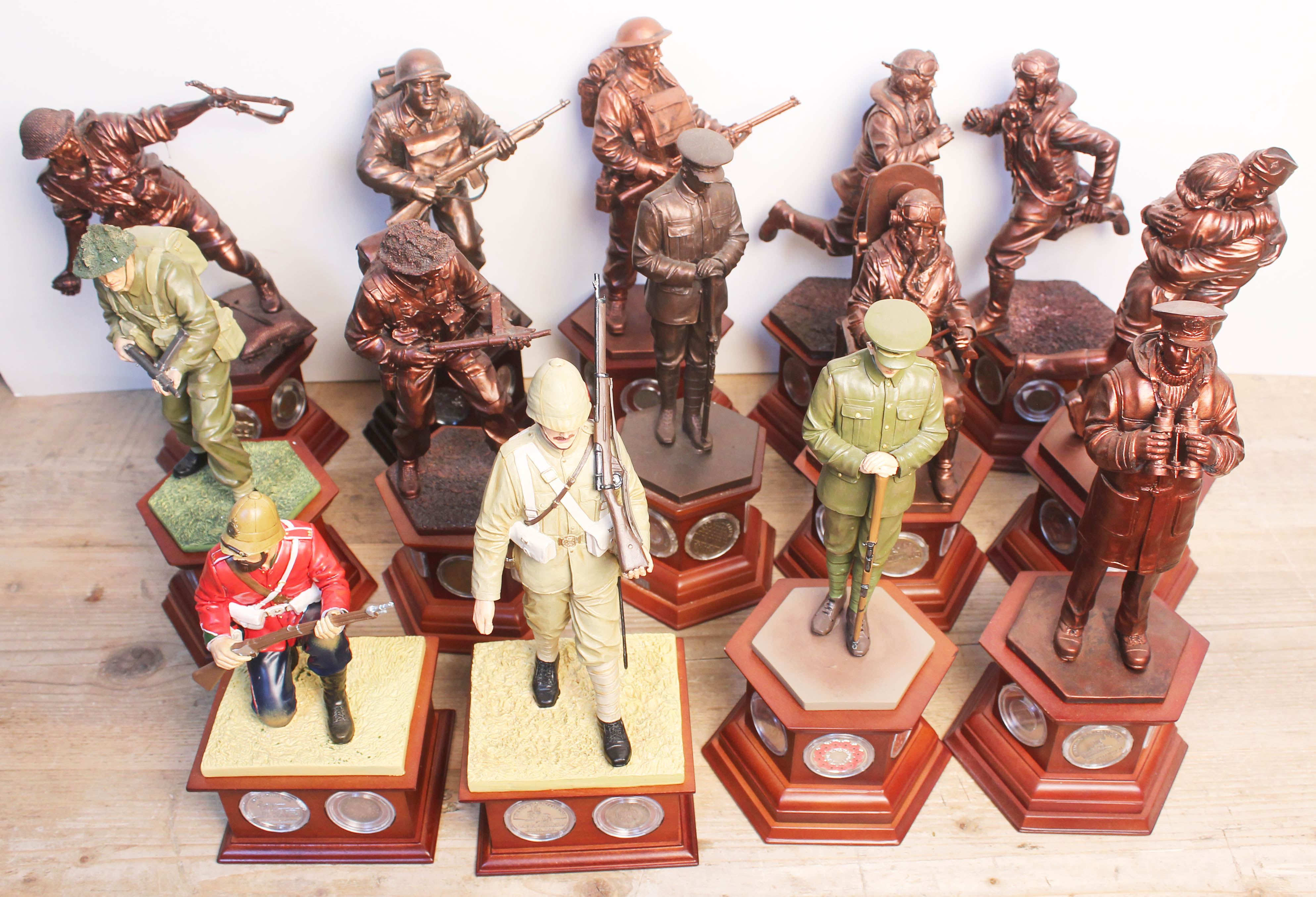 A collection of 14 Danbury Mint war commemorative figures, various ...