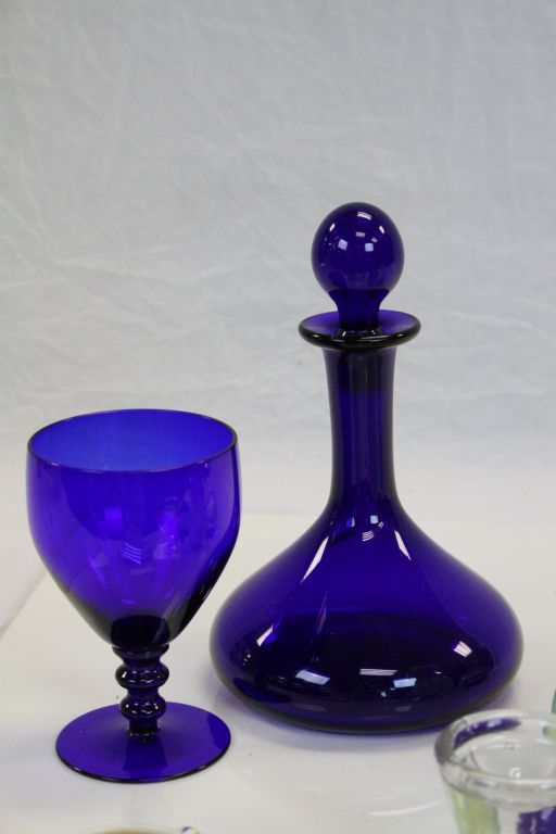A Thomas Webb blue glass decanter and wine glass, four paperweights to ...