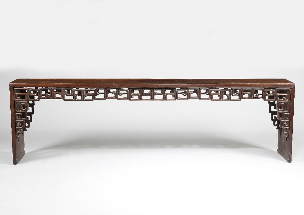 A CHINESE HARDWOOD SCROLL TABLE C.1900 The frieze carved in openwork ...