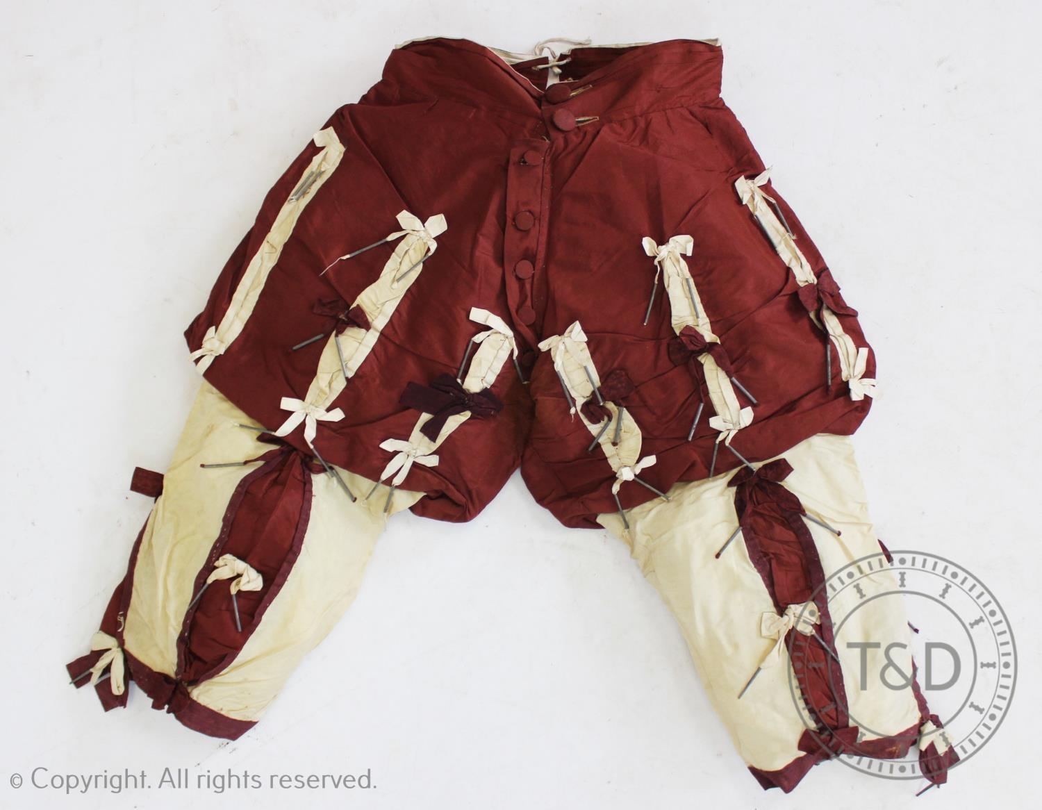 A pair of 17th century style silk taffeta breeches, in russet and cream ...