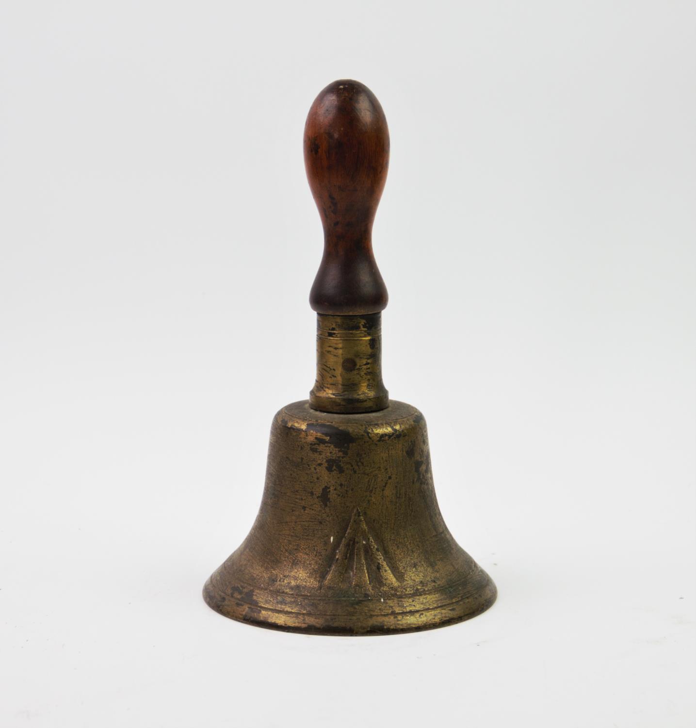 A military issue hand bell, with turned hard wood handle, cast in ...