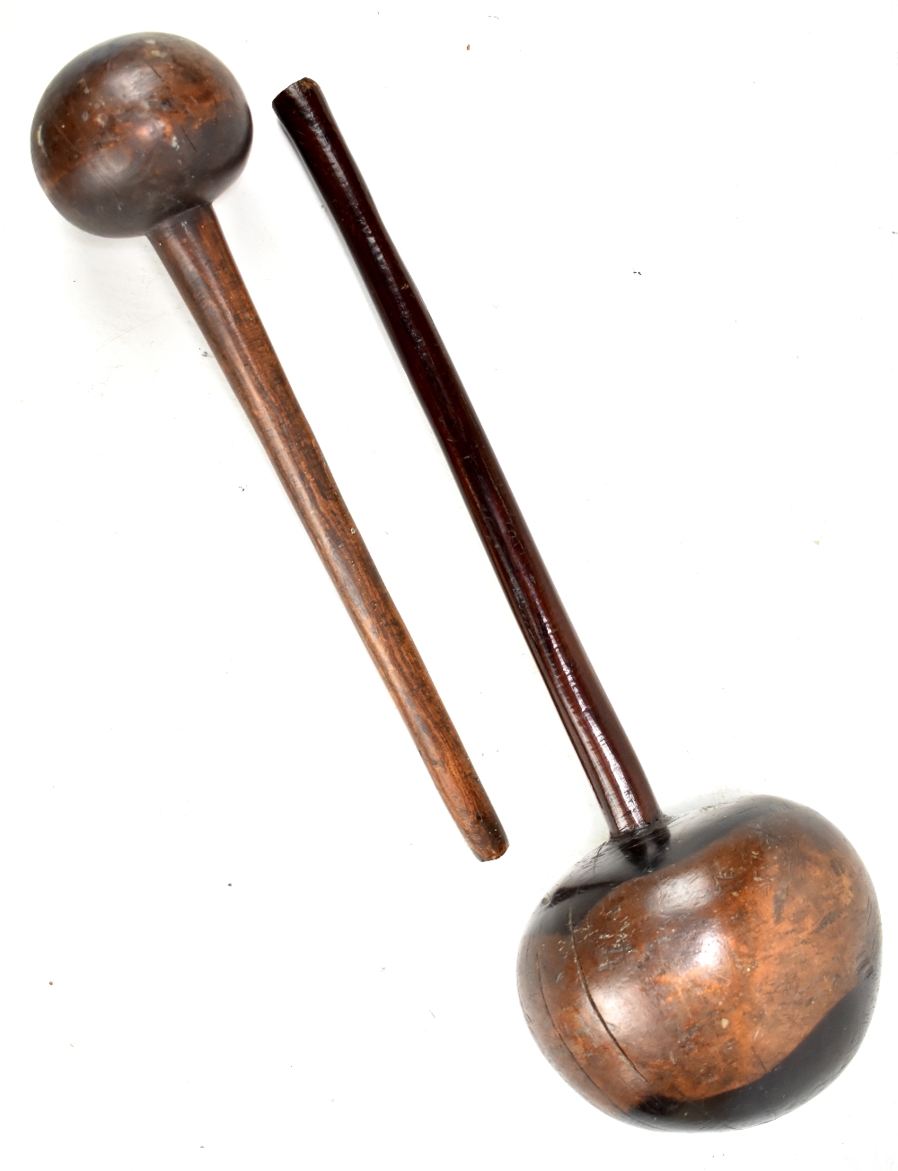 A large African wooden knobkerrie, diameter of top 17cm, together with ...
