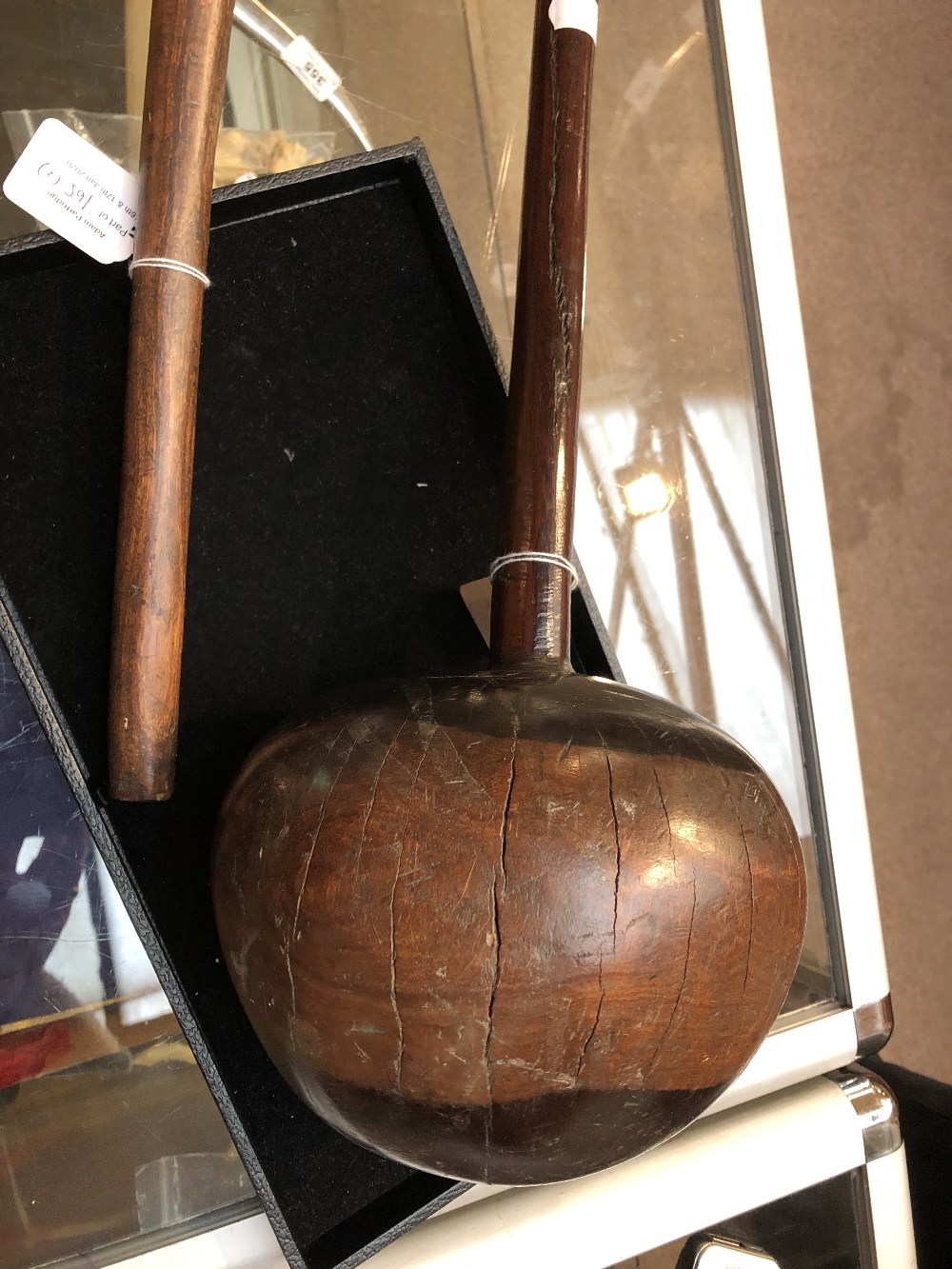A large African wooden knobkerrie, diameter of top 17cm, together with ...