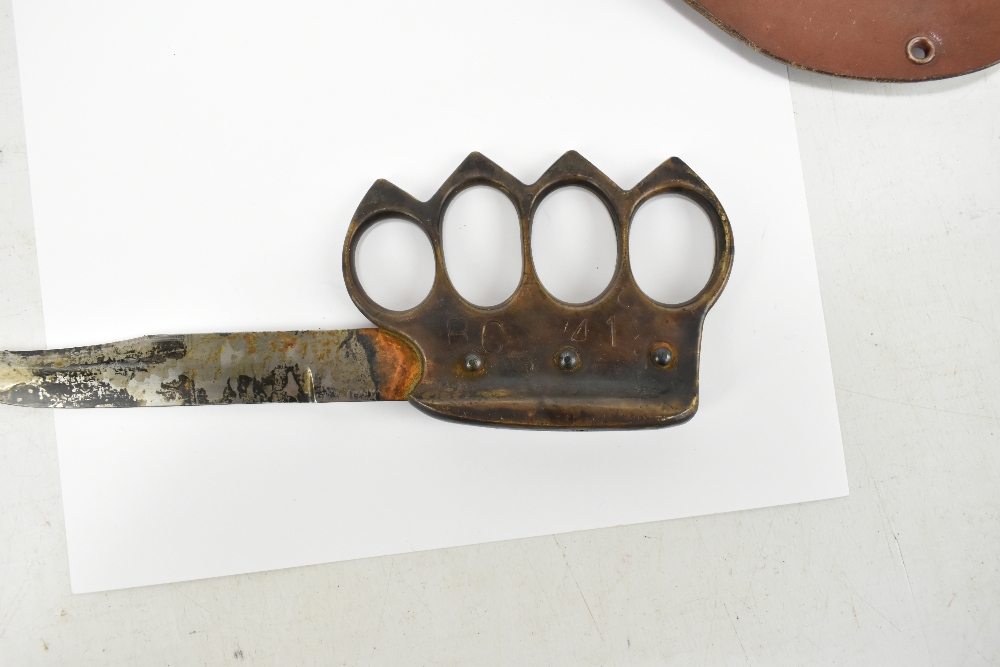 A WWII British BC-41 commando knife with combined knuckle duster and ...