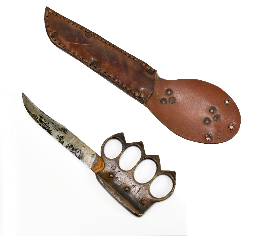 A WWII British BC-41 commando knife with combined knuckle duster and ...