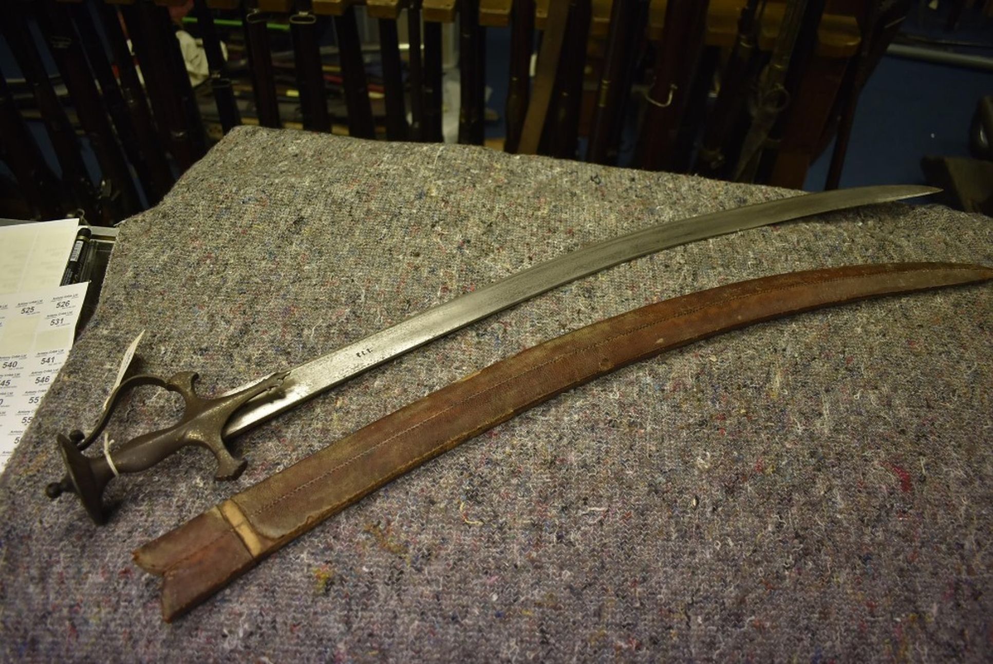 A 19TH CENTURY TULWAR, 77.5cm curved blade, probably damascus and ...