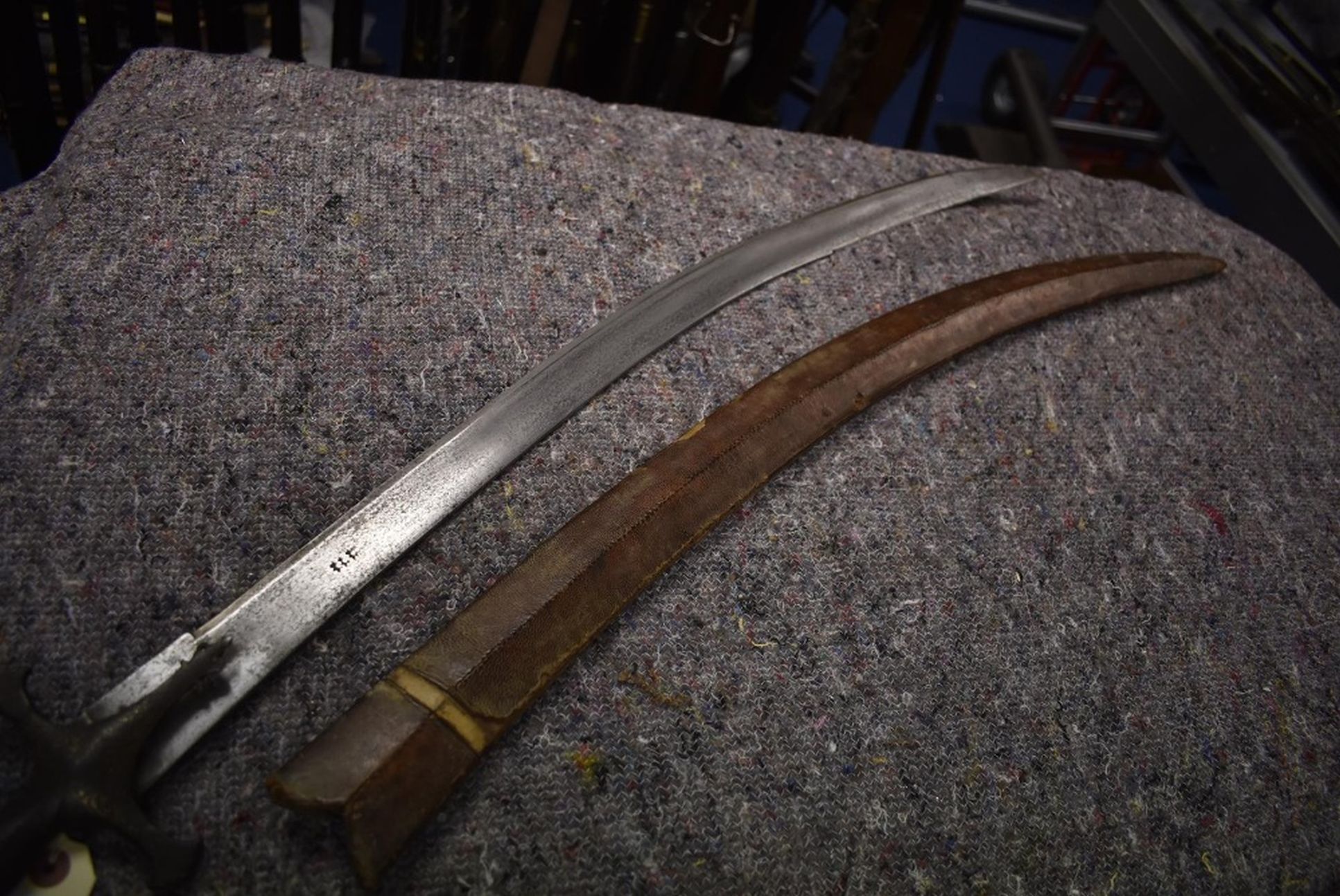 A 19TH CENTURY TULWAR, 77.5cm curved blade, probably damascus and ...