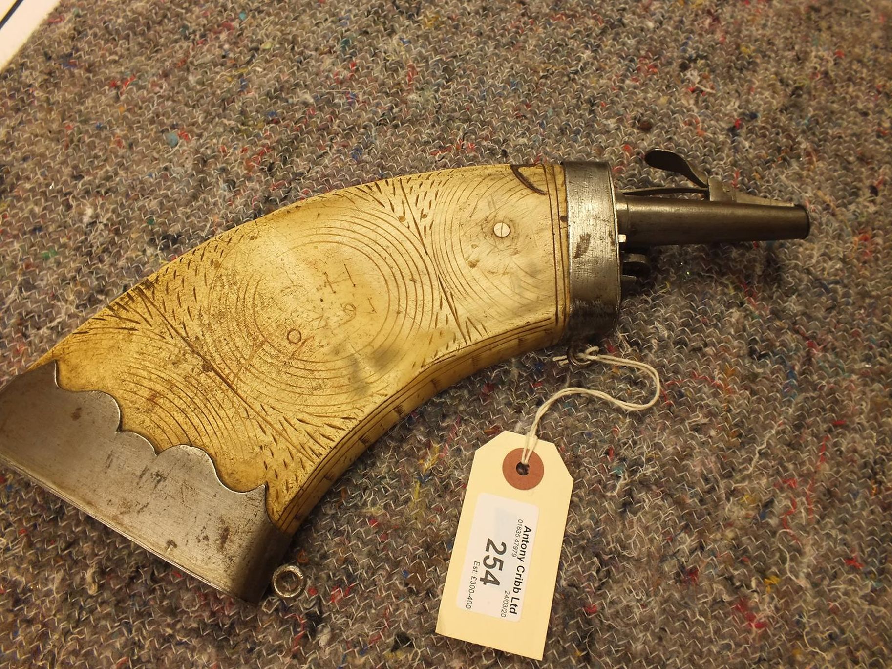 A 17TH CENTURY GERMAN POWDER FLASK, of characteristic flattened horn ...