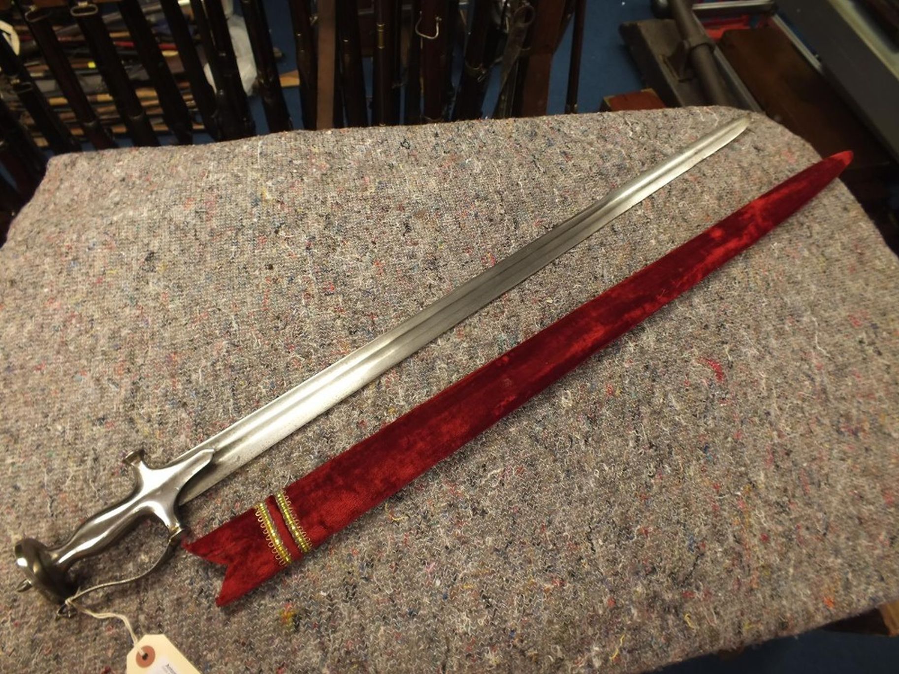 A 19TH CENTURY INDIAN KIRACH OR STRAIGHT SWORD, 79.5cm double fullered ...