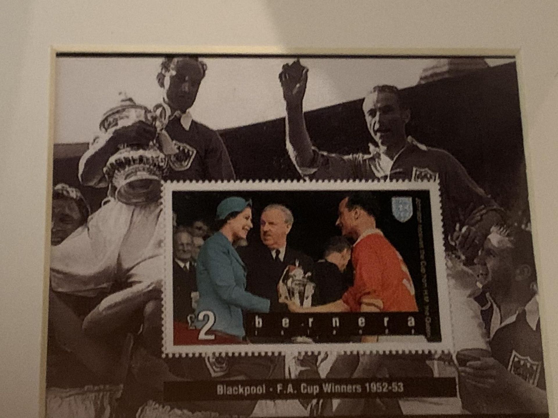 A SIR STANLEY MATTHEWS SIGNED COMMEMORATIVE POSTCARD AND STAMP IN A MOUNT