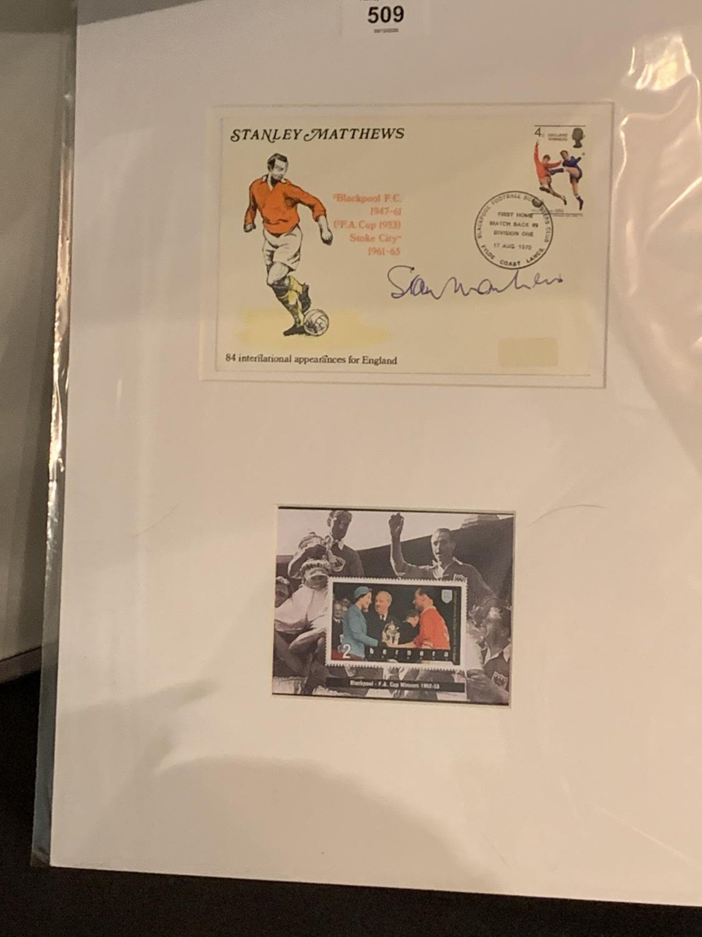 A SIR STANLEY MATTHEWS SIGNED COMMEMORATIVE POSTCARD AND STAMP IN A MOUNT