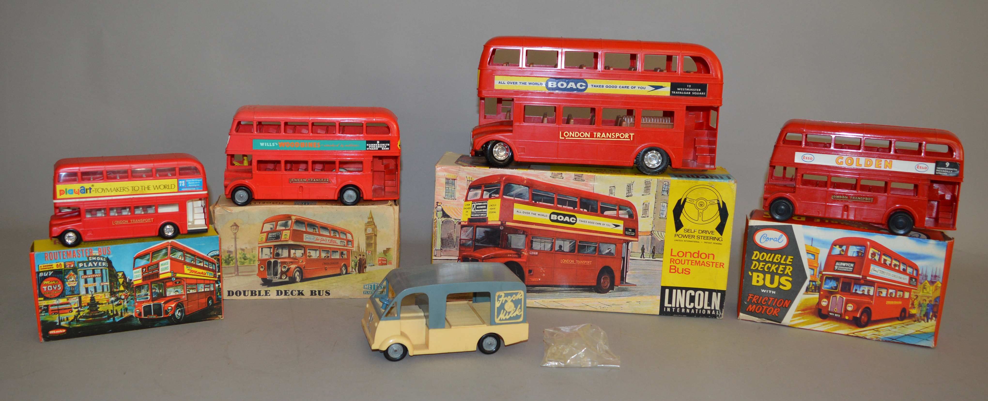 A selection of vintage boxed larger scale plastic London Bus models ...