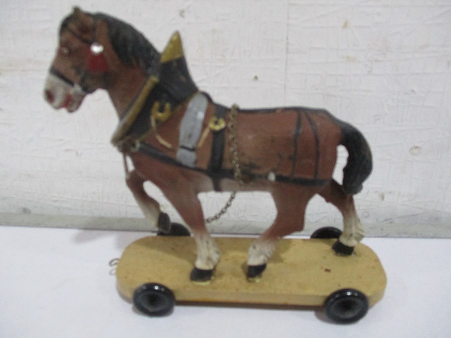 A wooden and card Elastolin stable with two cart horses, hay manger ...