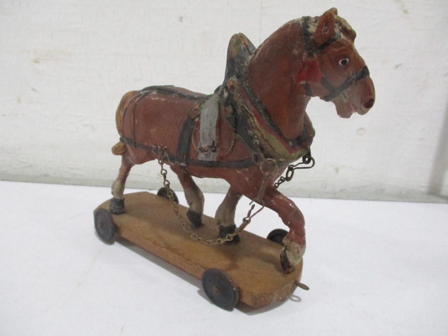 A wooden and card Elastolin stable with two cart horses, hay manger ...