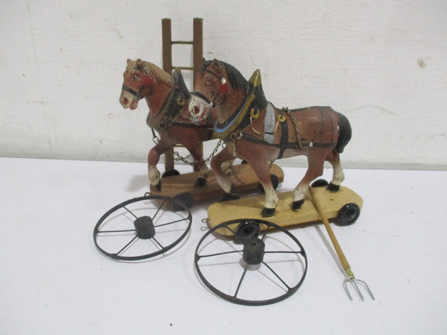 A wooden and card Elastolin stable with two cart horses, hay manger ...