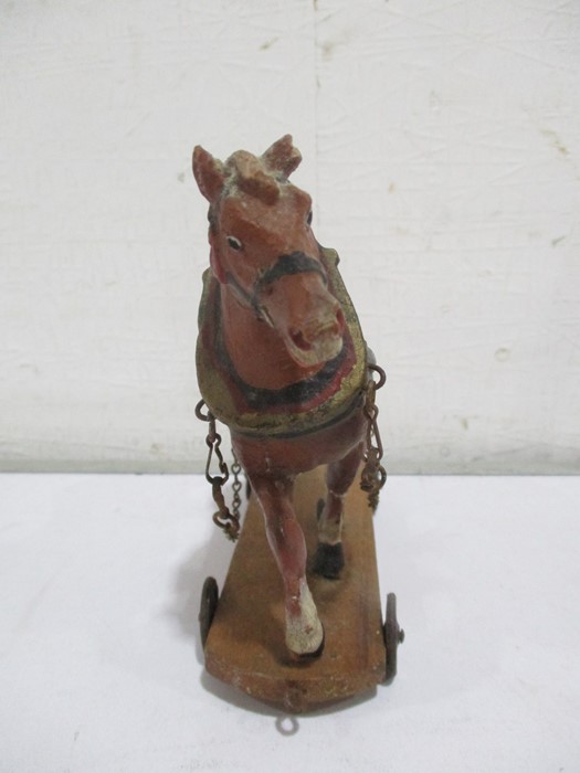 A wooden and card Elastolin stable with two cart horses, hay manger ...