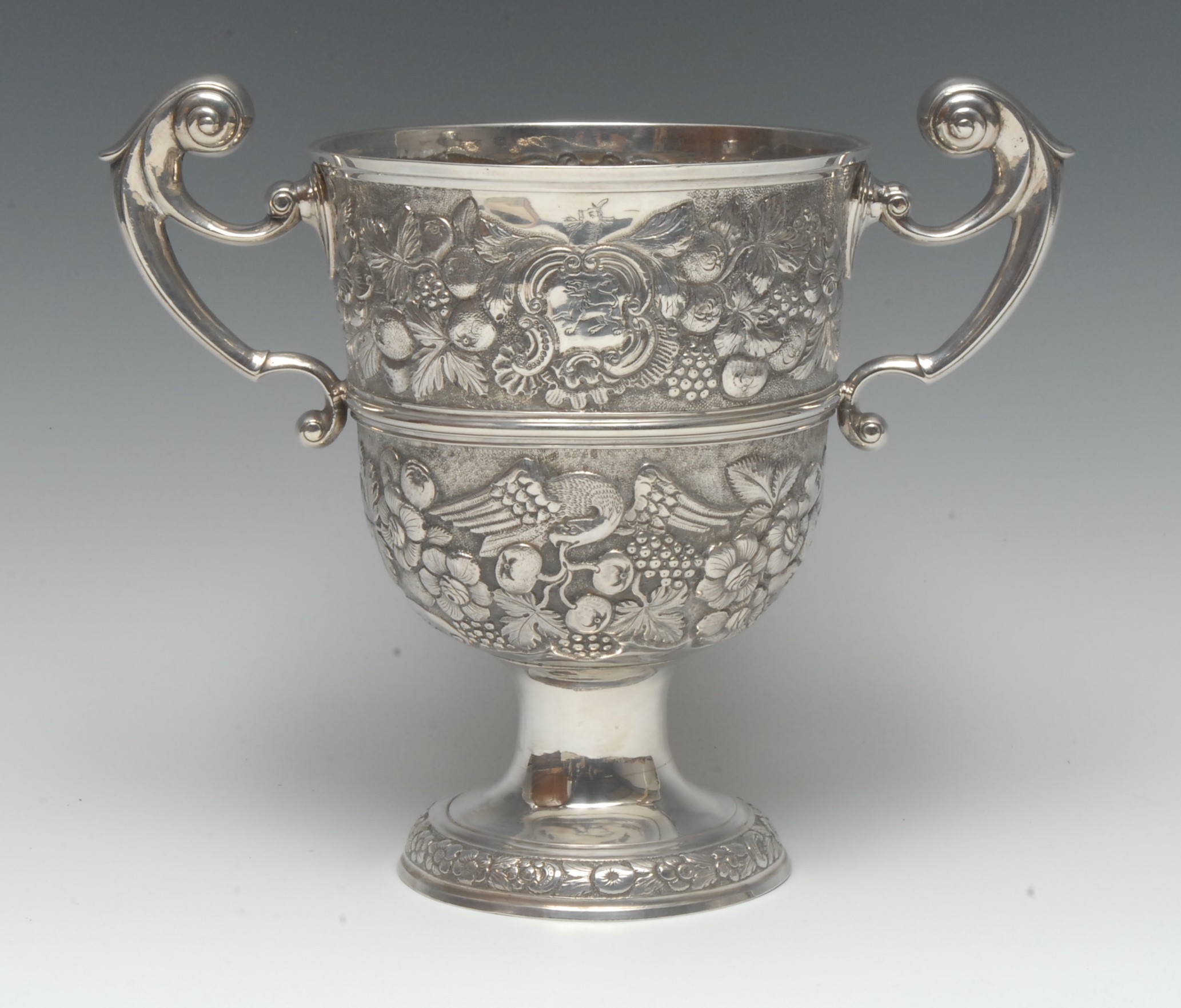 A large George II Irish silver two-handled pedestal loving cup, chased ...