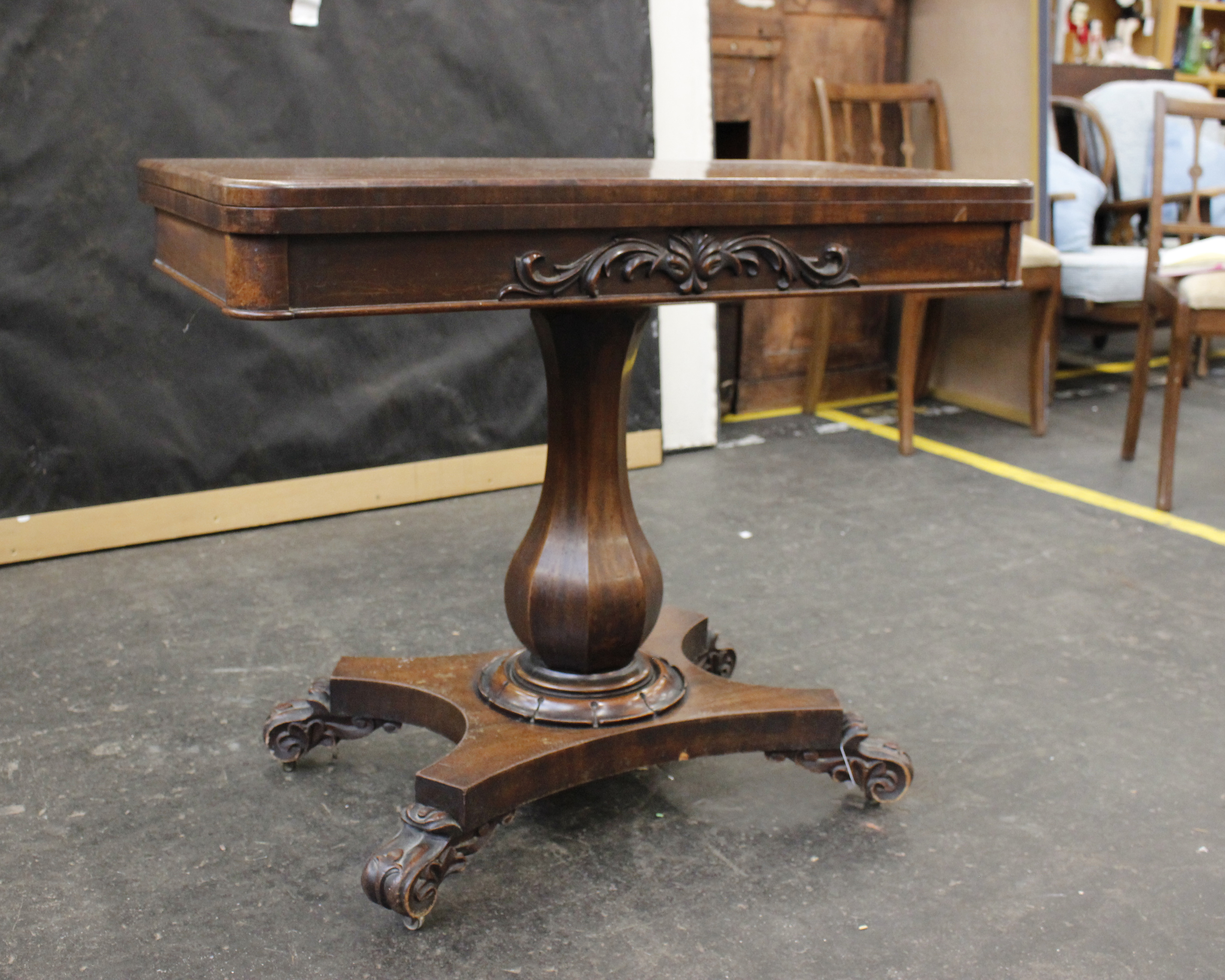 A Victorian mahogany flip top card table with circular inset top ...