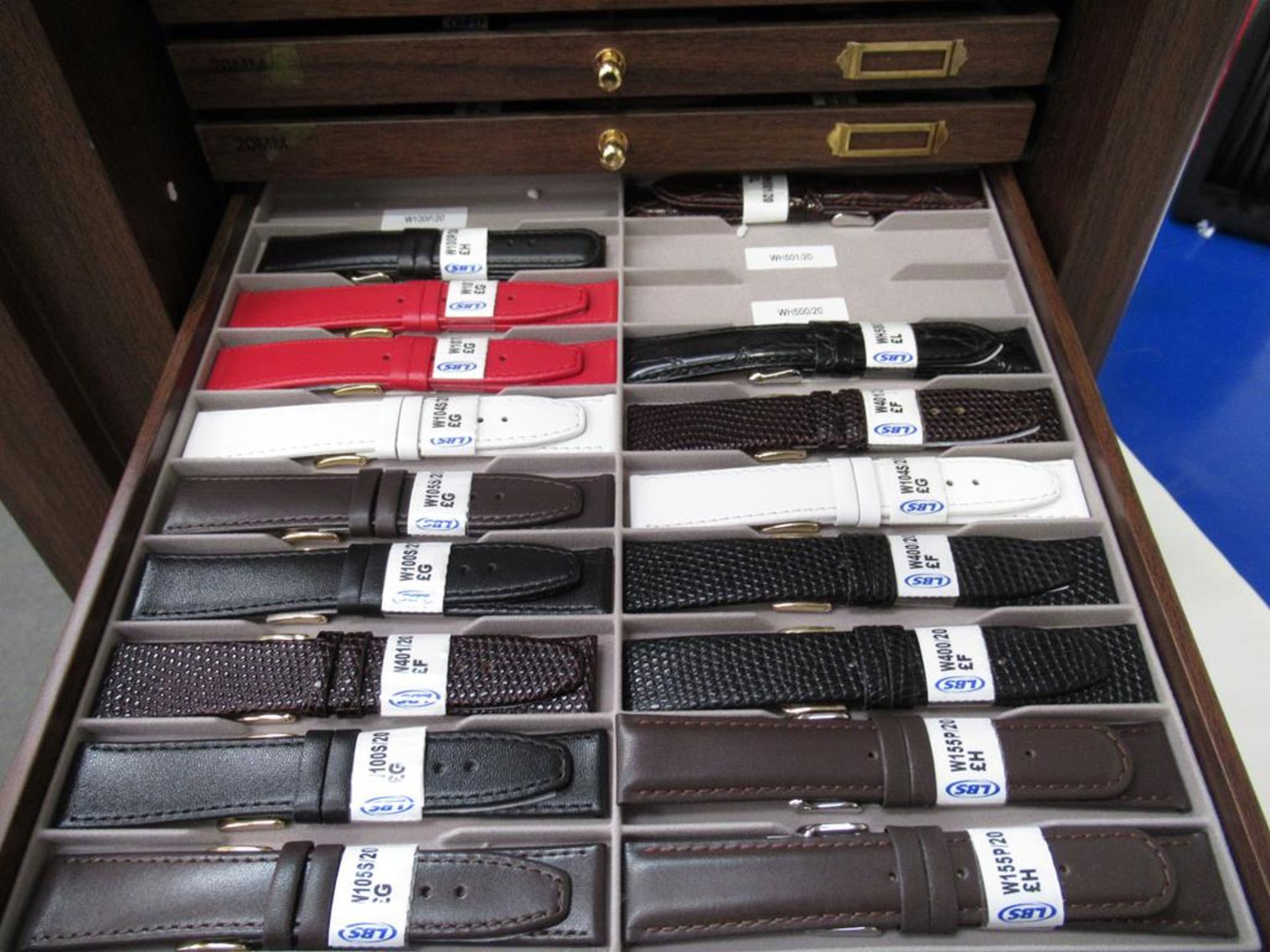 A Jewellers 'LBS' Watch Strap Display Carousel together with 24 watch ...