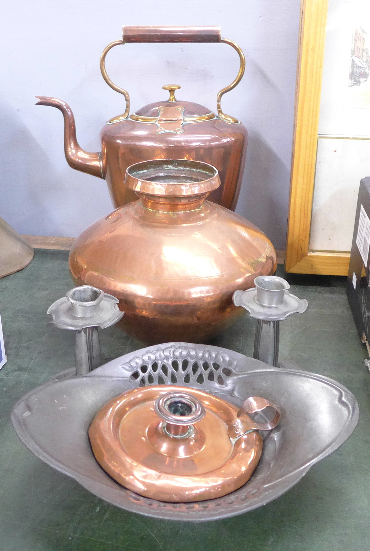 An Art Nouveau pewter bowl and a pair of candlesticks, a hammered ...