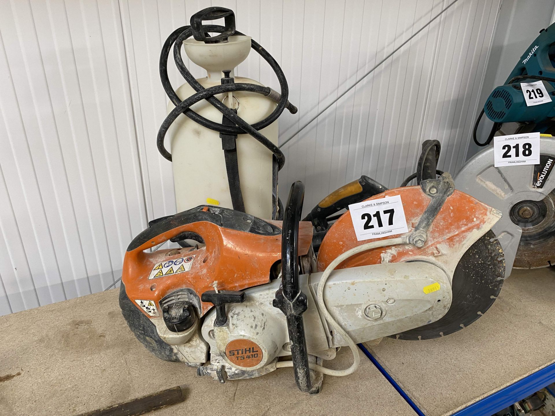 Stihl TS 410 disc petrol disc cutter and water bottle.