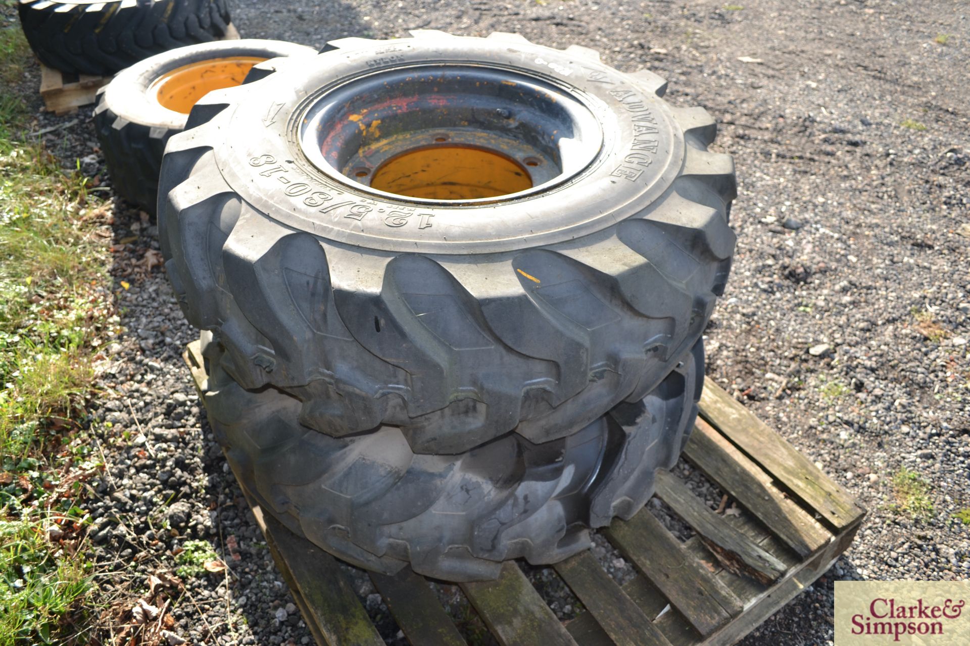 Pair of JCB 3CX 12.5-18 front wheels and tyres.