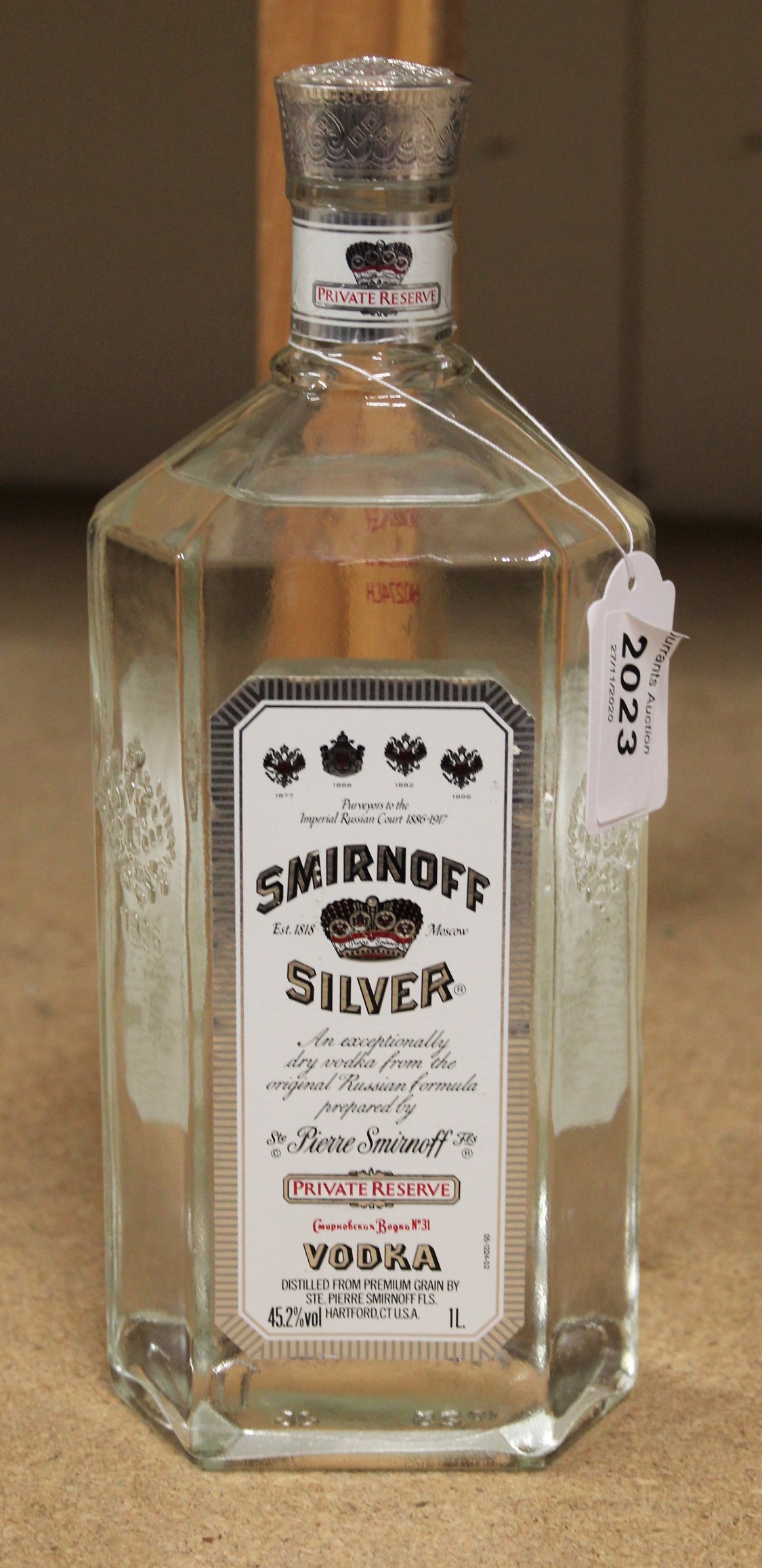 A litre bottle of Smirnoff Silver Label Private Reserve vodka c.1980's