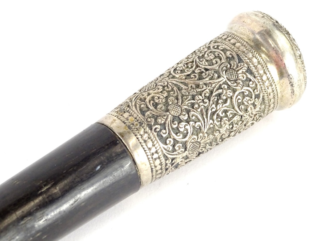 A small Indian ebony and white metal mounted swagger stick, with ...
