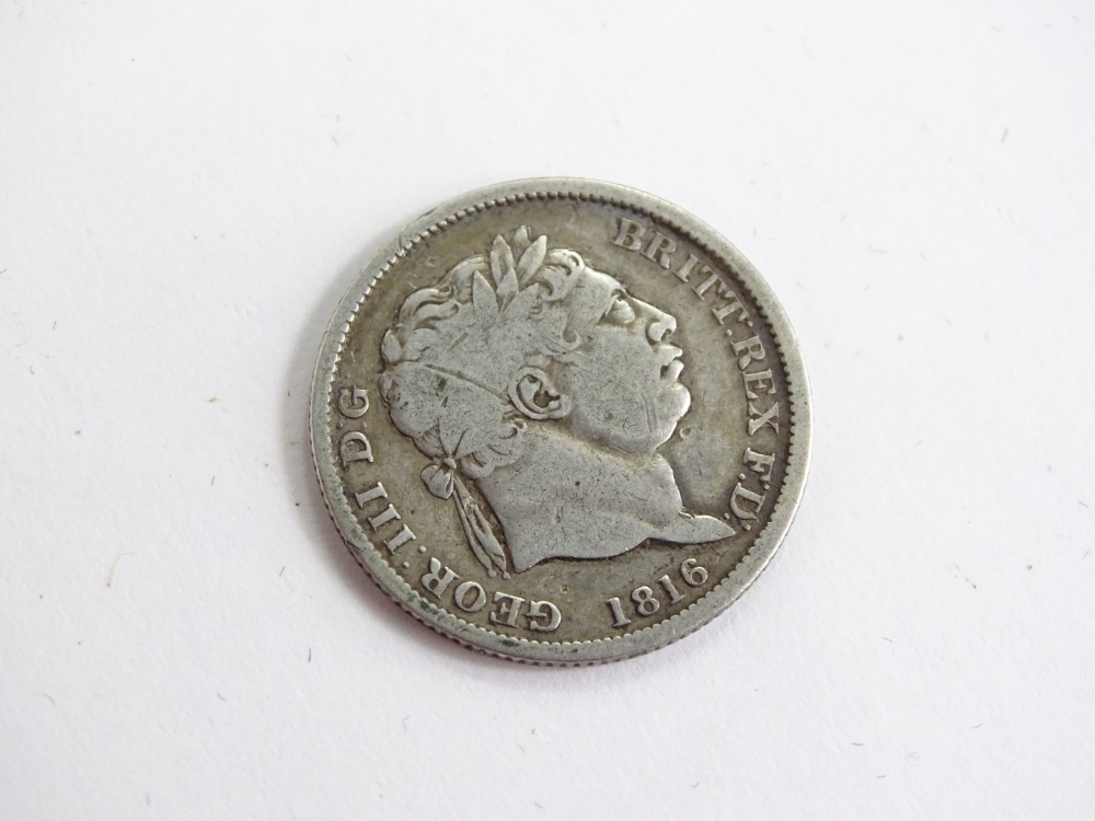 A George III bullhead shilling 1816.