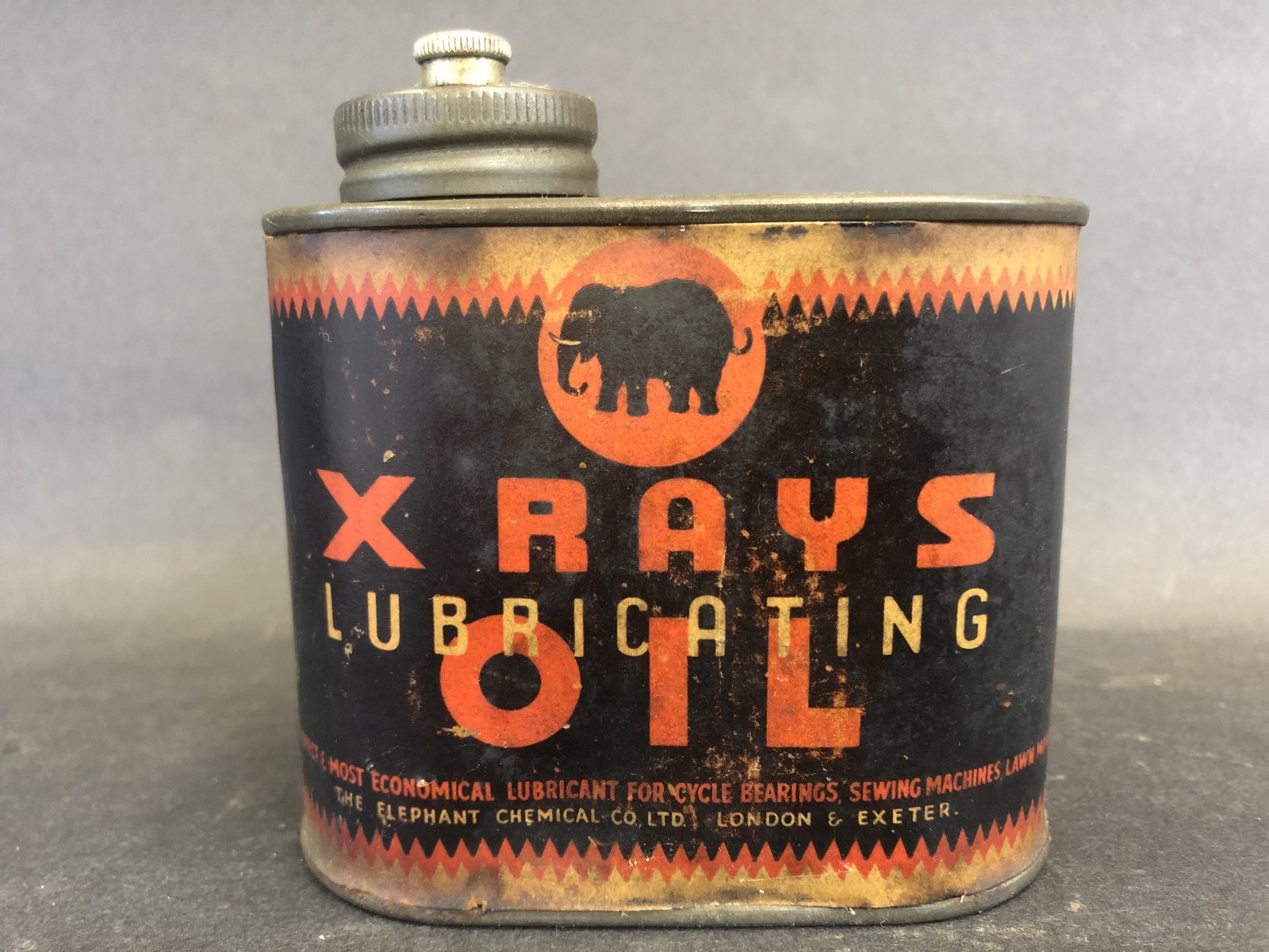 An unusual X Rays Lubricating Oil oval can with paper label.