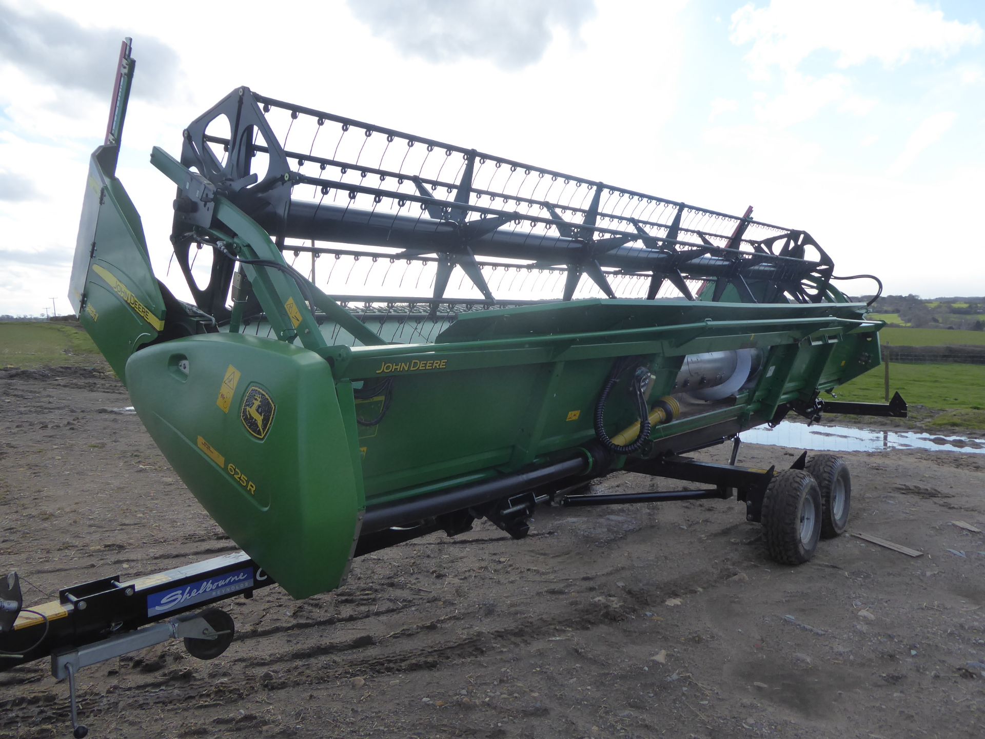 John Deere T560i Hillside combine harvester c/w 625R header and trailer ...