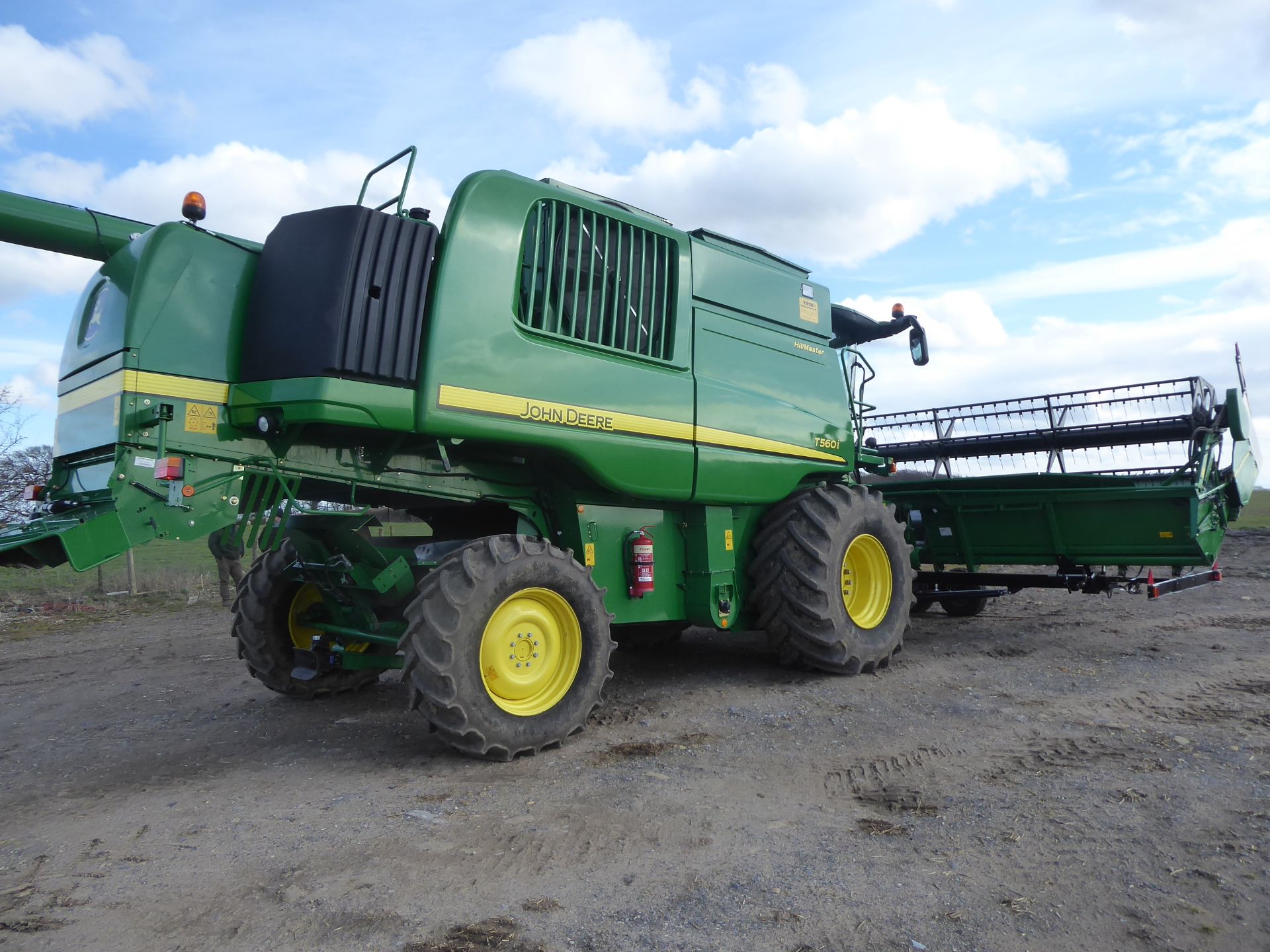 John Deere T560i Hillside combine harvester c/w 625R header and trailer ...