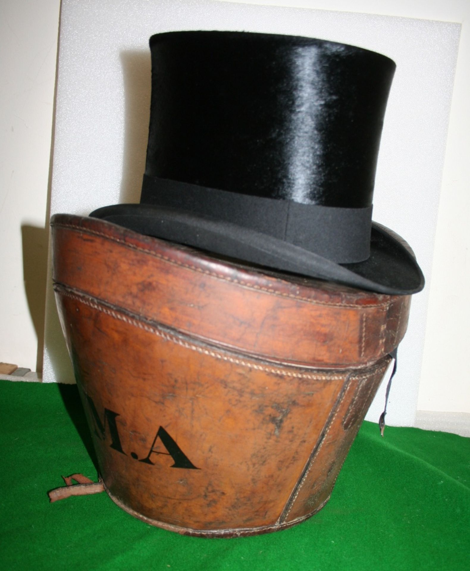 Silk top hat by Henry Heath size 7 1/4, with a leather hat box Estimate ...