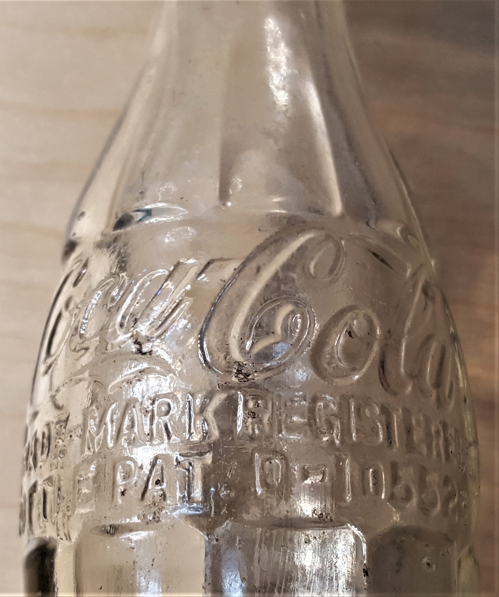 WW2 U.S. Coca-Cola glass bottle dated 1944. The bottle is embossed on ...