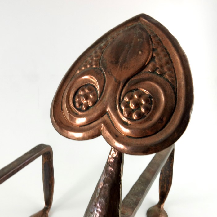A pair of Arts and Crafts copper andirons, hand wrought, with repousse ...