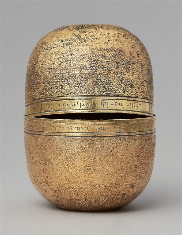 A Herrengrund double beakerEngraved and gilt copper beaker formed from ...