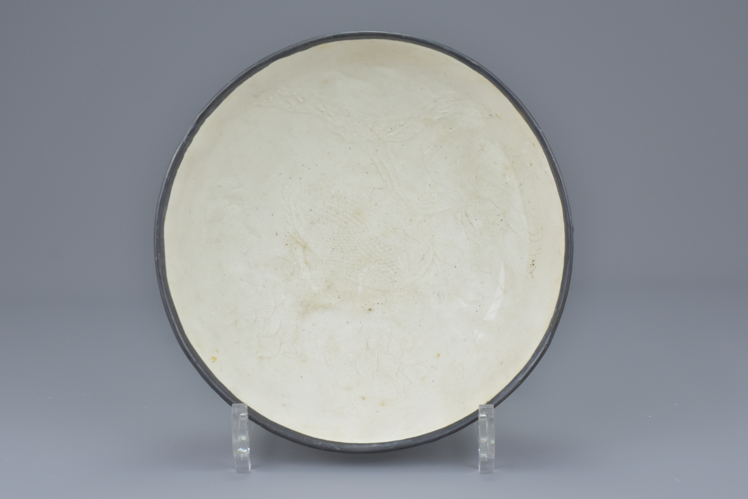 A Chinese Song dynasty (960-1279) white glazed Ding type pottery bowl ...