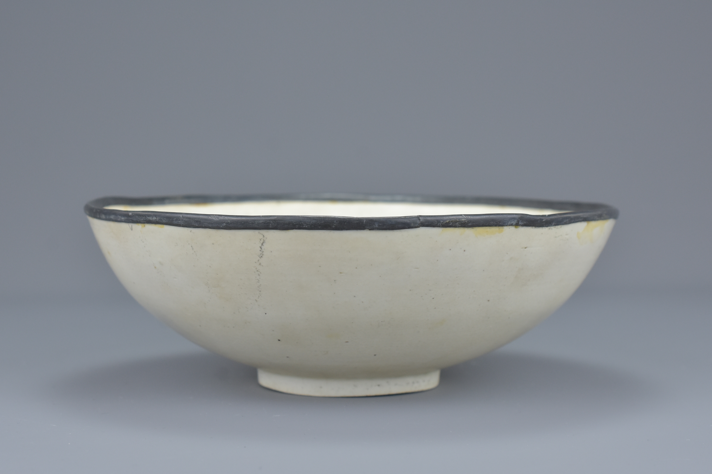 A Chinese Song dynasty (960-1279) white glazed Ding type pottery bowl ...