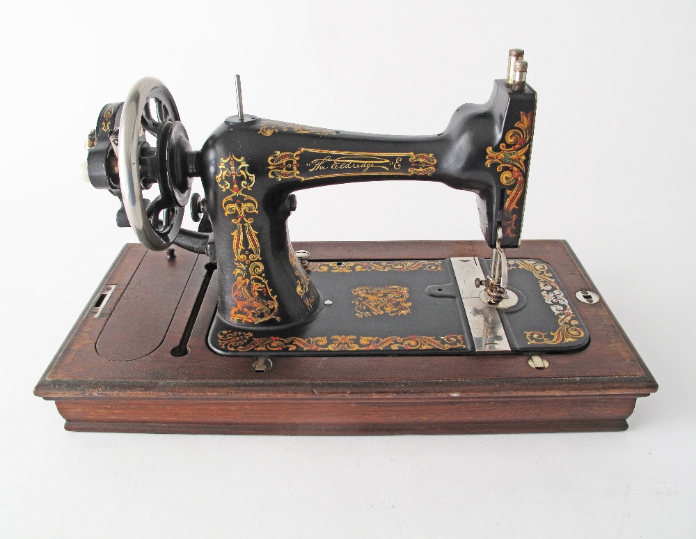 An American portable hand powered Eldredge sewing machine with arched ...