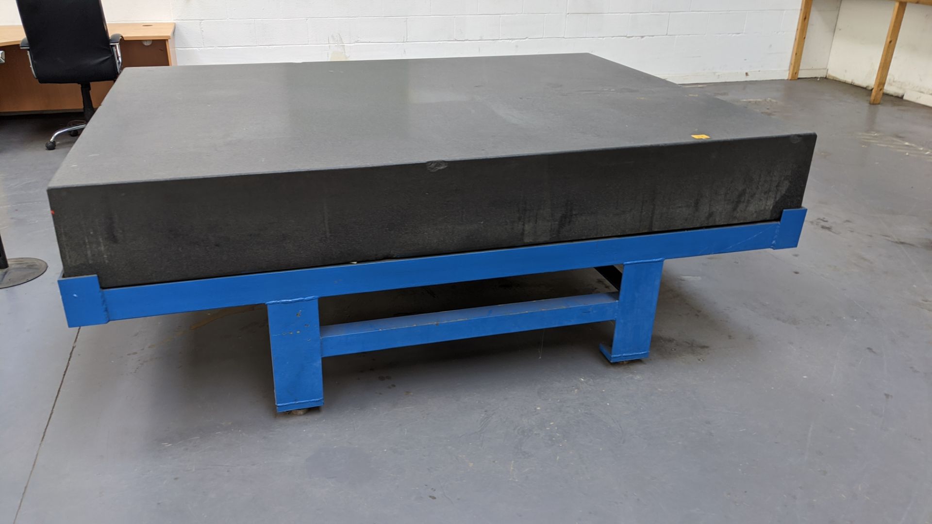 Large granite table on metal frame with adjustable feet. Granite block ...