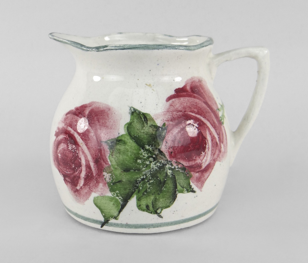 A LLANELLY POTTERY MILK JUG painted with tea-roses and leaves ...
