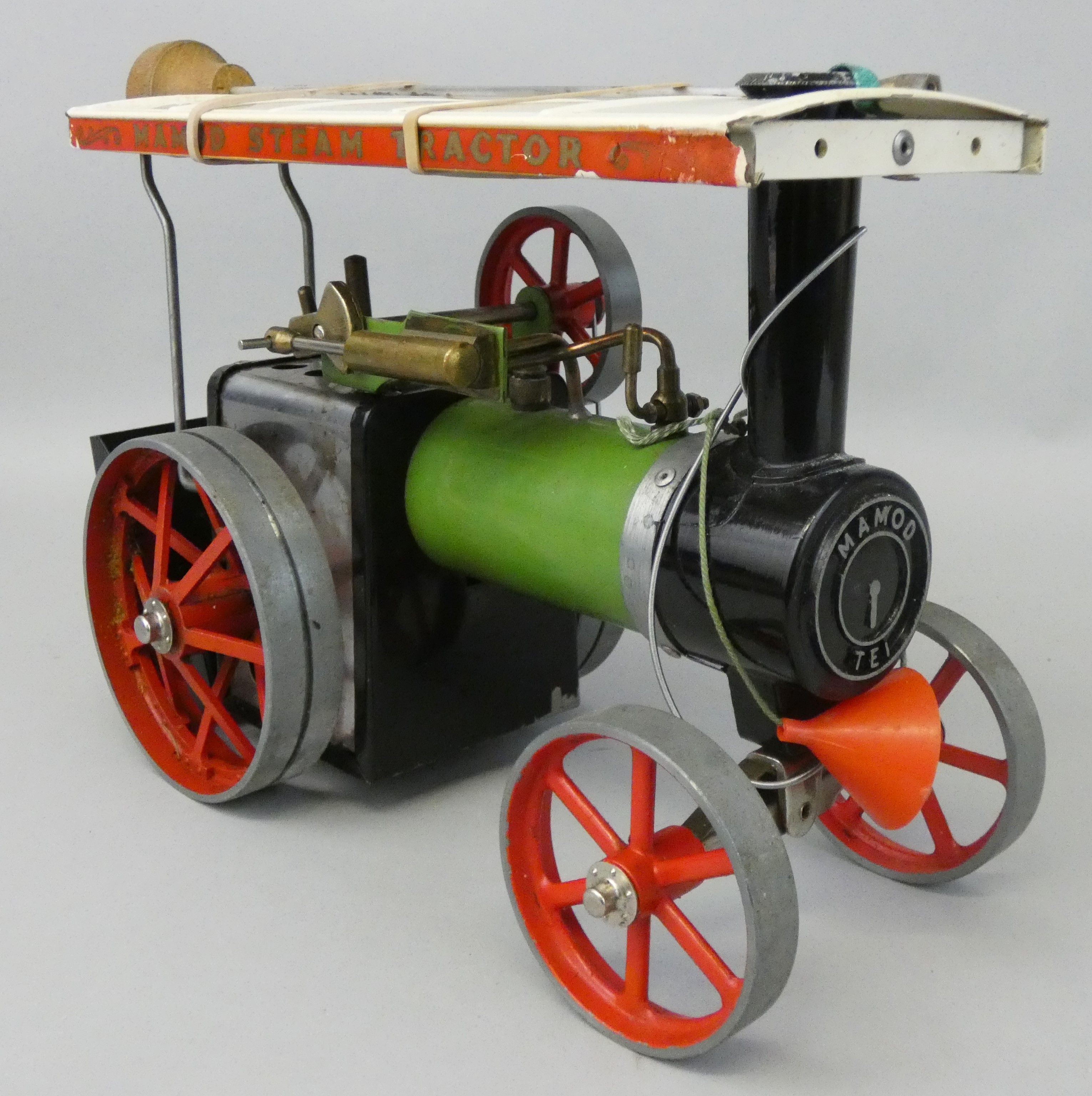 A Mamod live steam showman's engine TE1, with burner and steering stick.