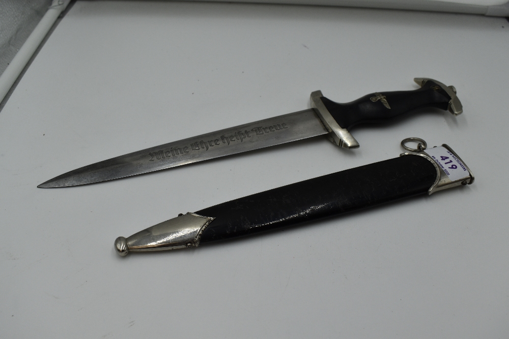 A German SS Officers Dagger c1936, with metal scabbard, black grip with ...