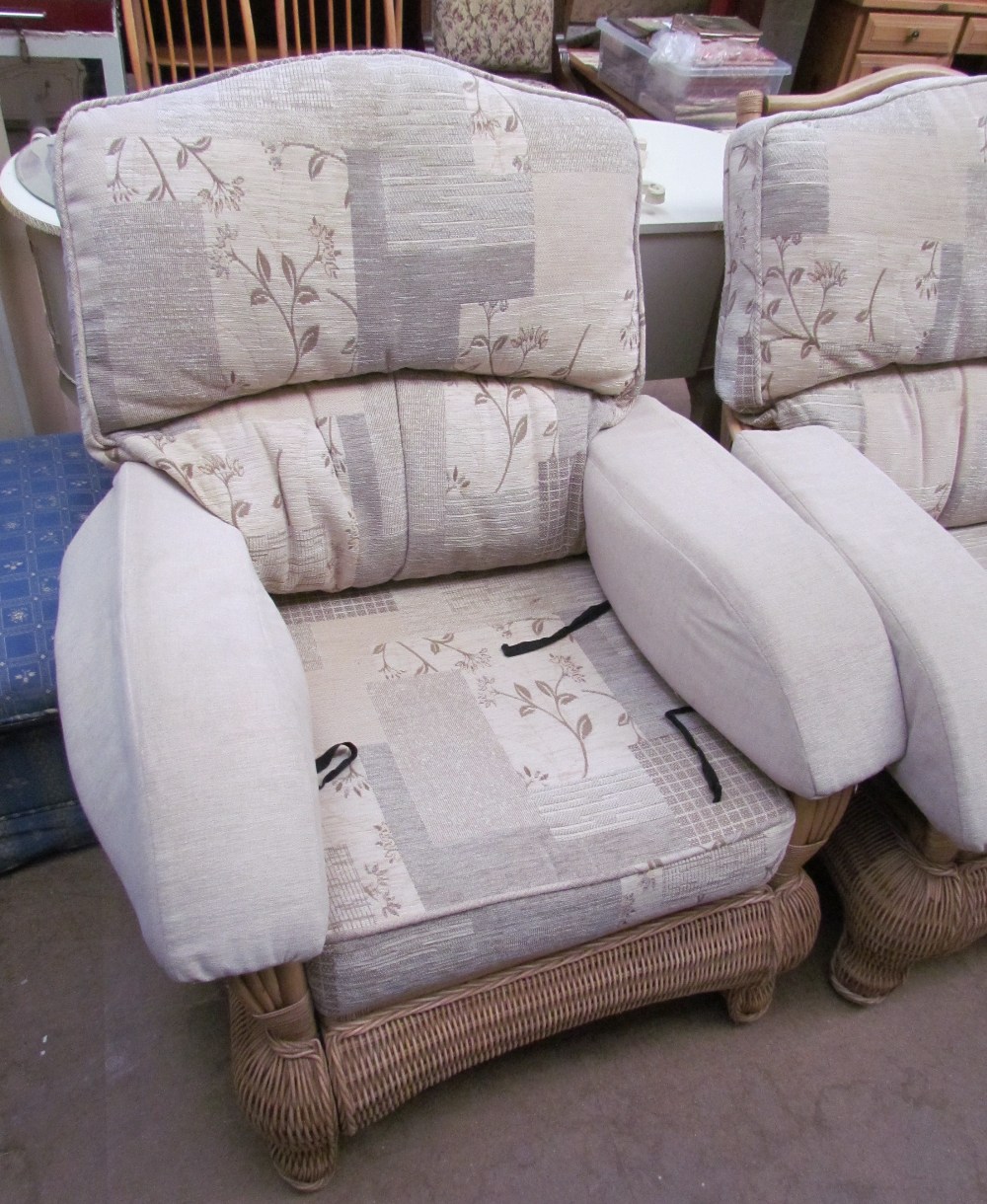 A set of four conservatory armchairs with floral upholstery and another ...