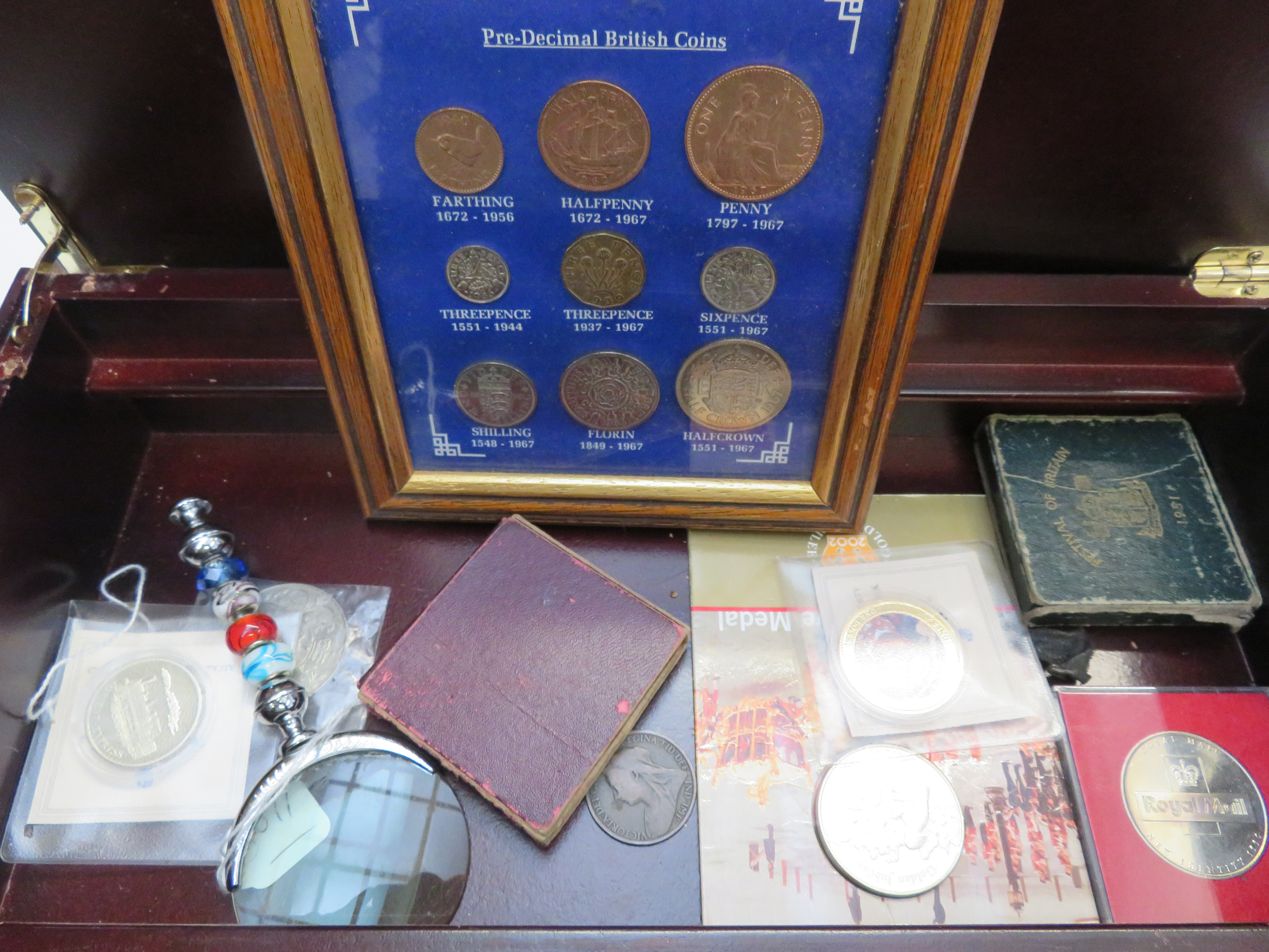 Coin collection to include a magnifying glass