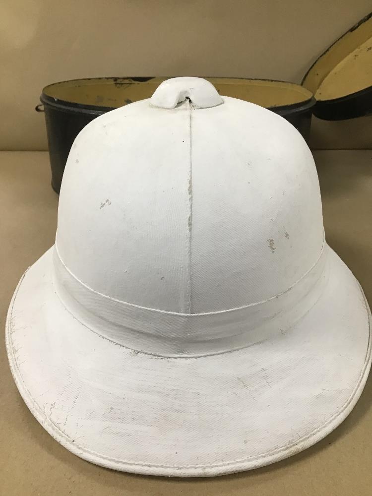 A ROYAL NAVY PITH HELMET IN ORIGINAL METAL CARRYING CASE, ENGRAVED ...