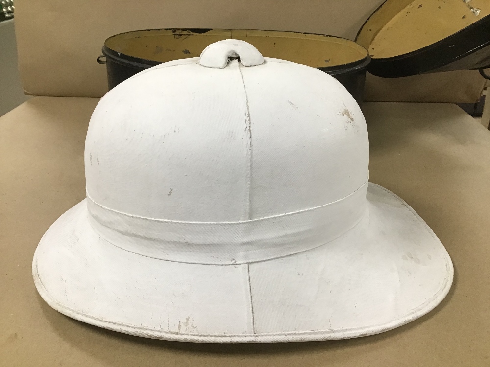 A ROYAL NAVY PITH HELMET IN ORIGINAL METAL CARRYING CASE, ENGRAVED ...
