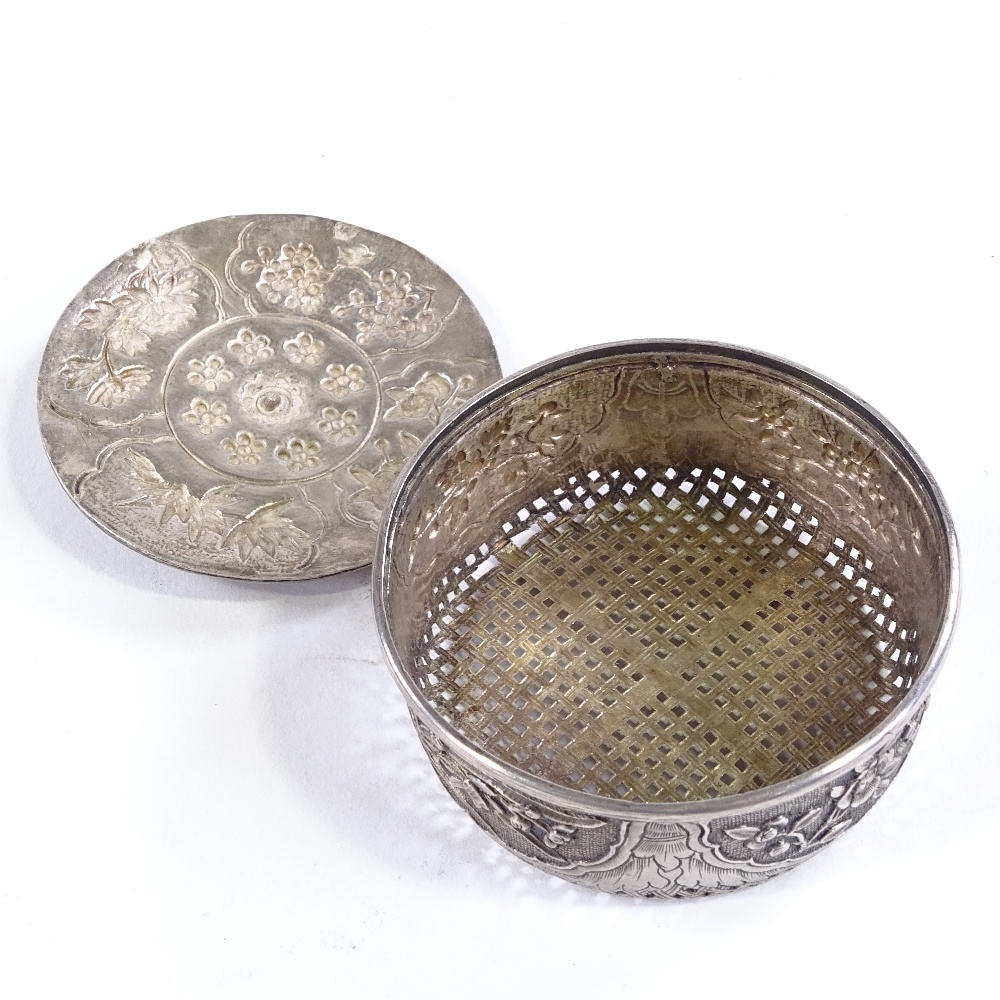 A Chinese unmarked silver cricket cage, circa 1900, parcel gilt relief ...