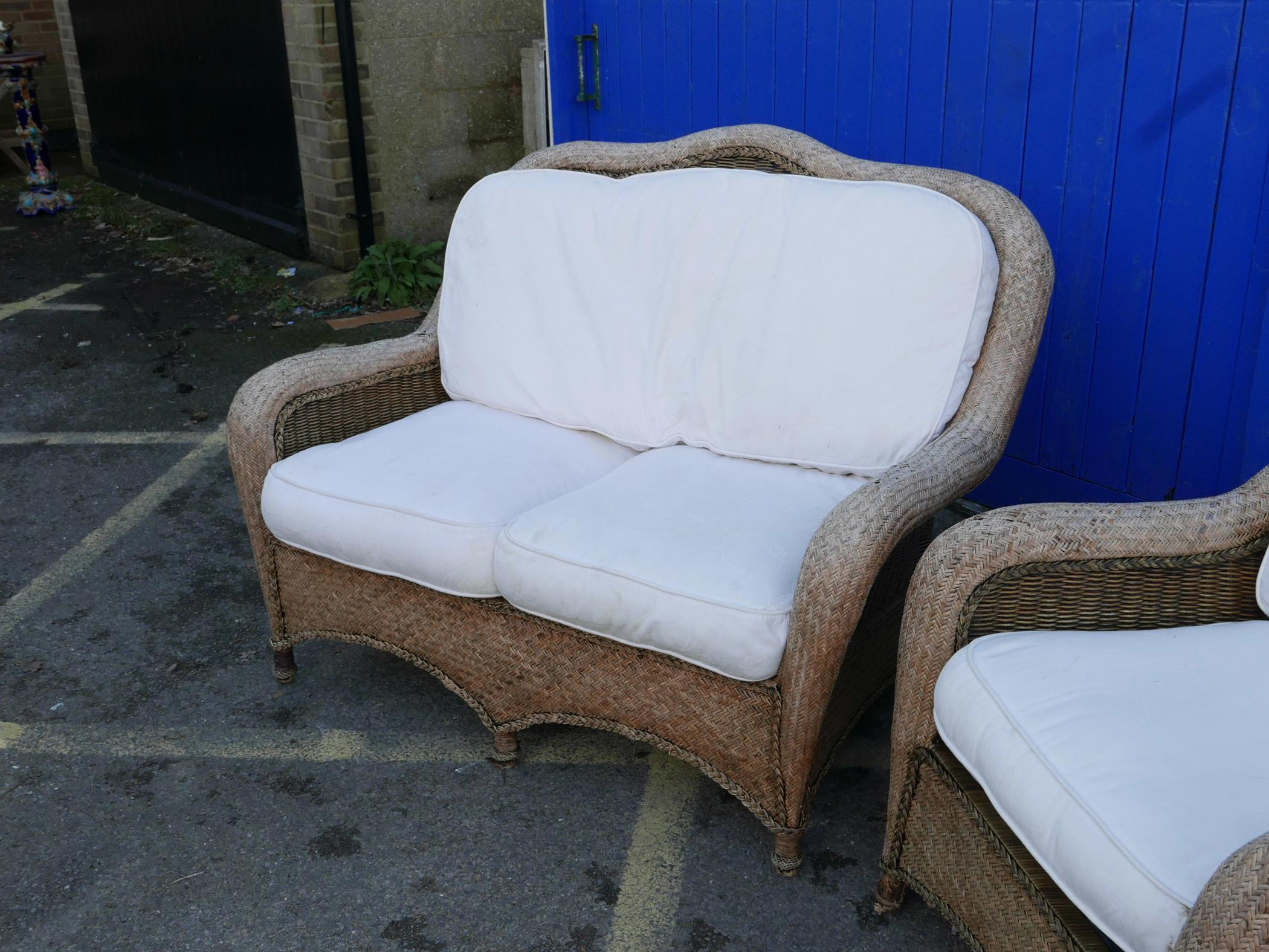 A woven wicker and rattan conservatory suite comprising two seater ...